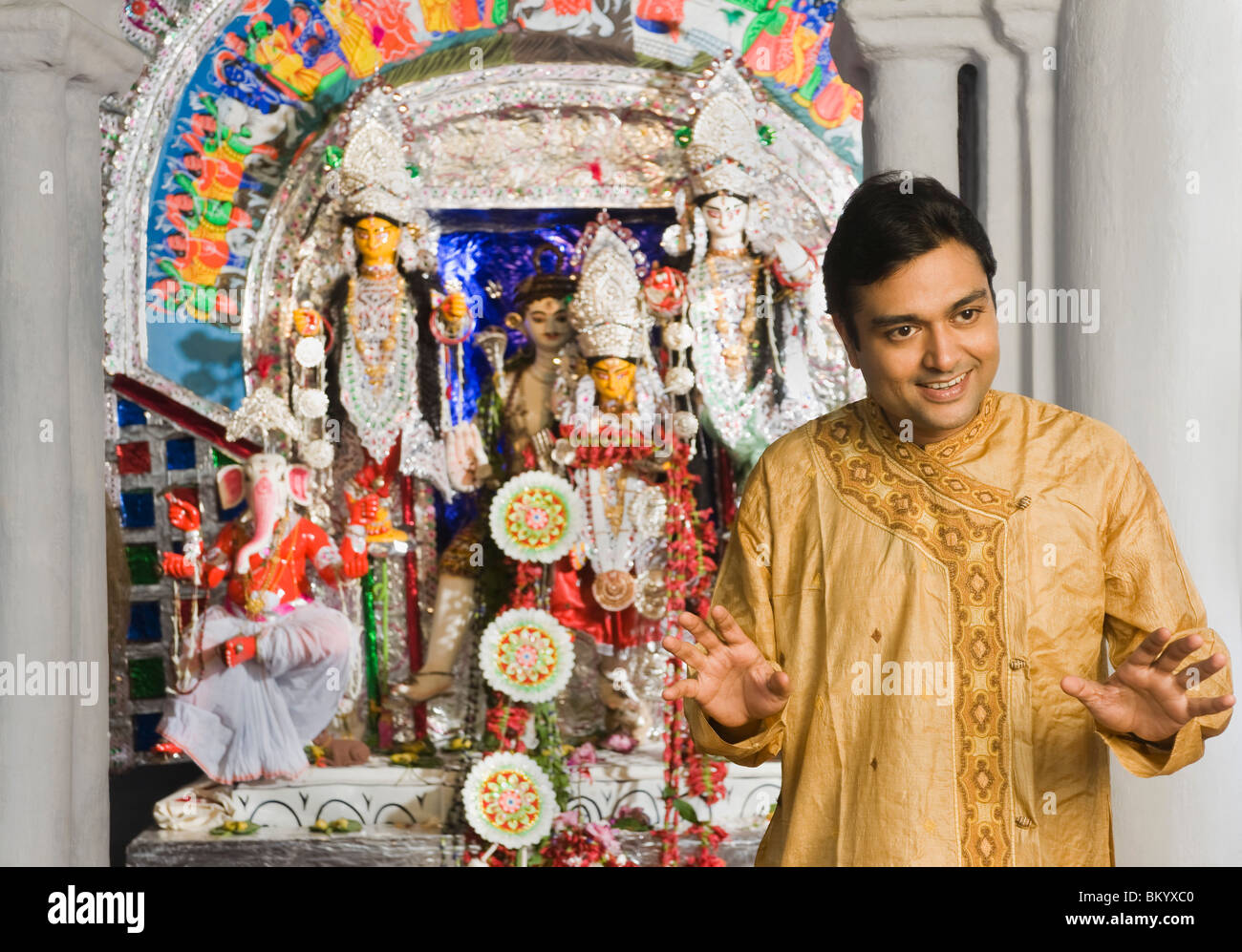 Man standing in a temple Stock Photo - Alamy