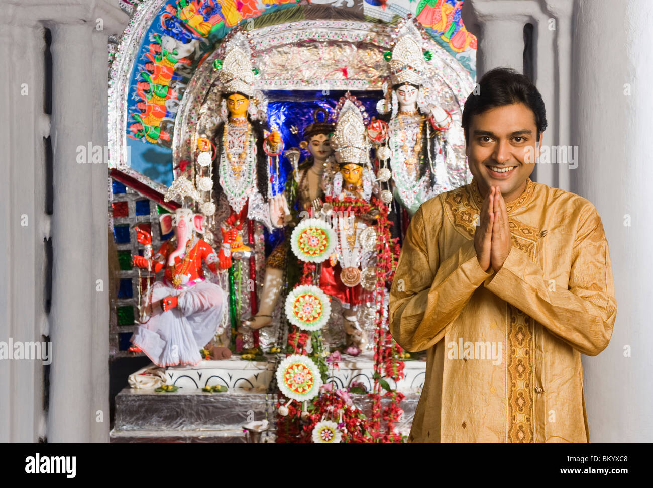 Man praying in a temple Stock Photo - Alamy