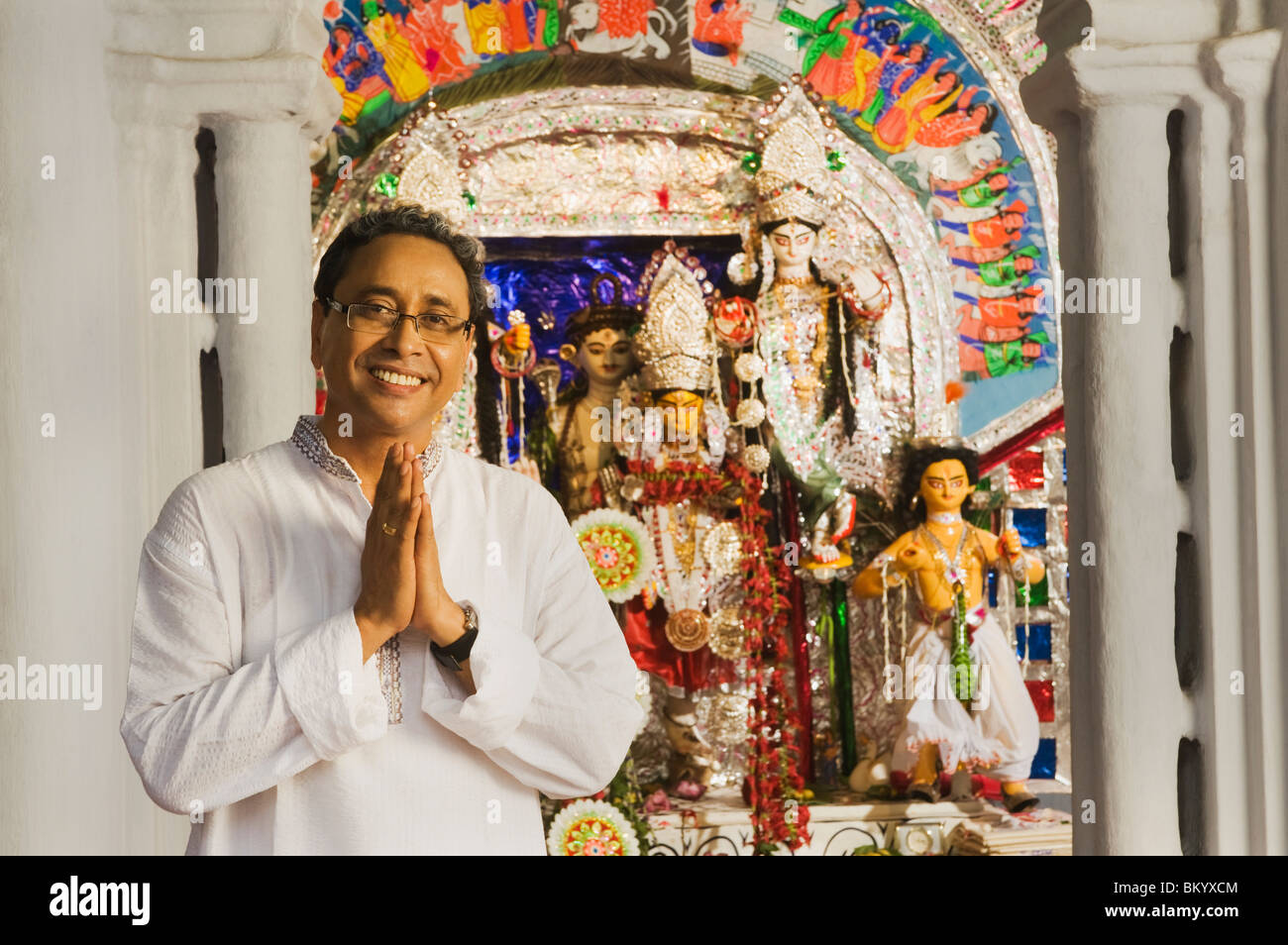Man praying in front temple hi-res stock photography and images - Alamy