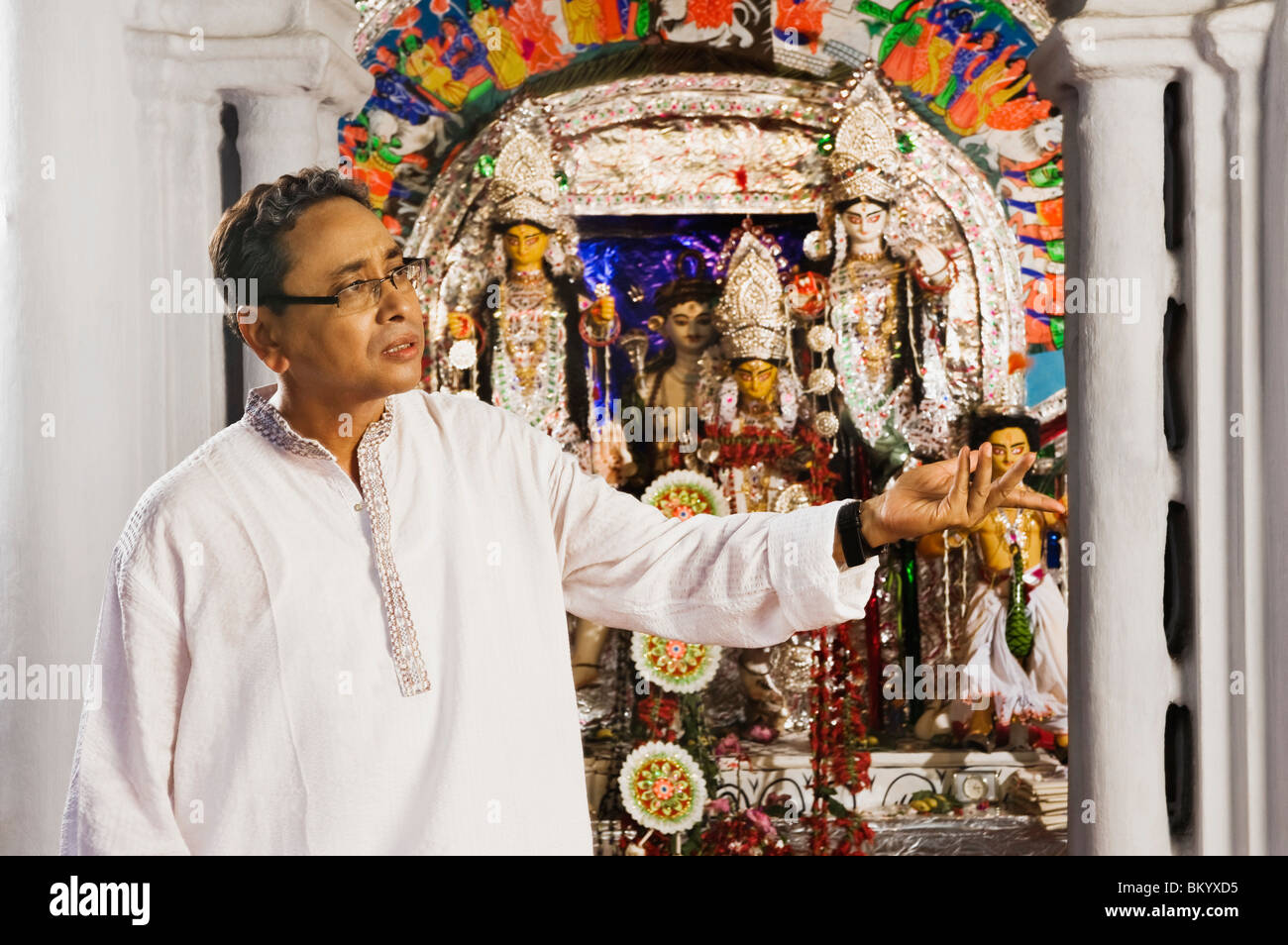 Man standing in a temple Stock Photo - Alamy