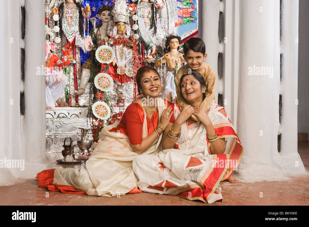 Family in a temple Stock Photo - Alamy