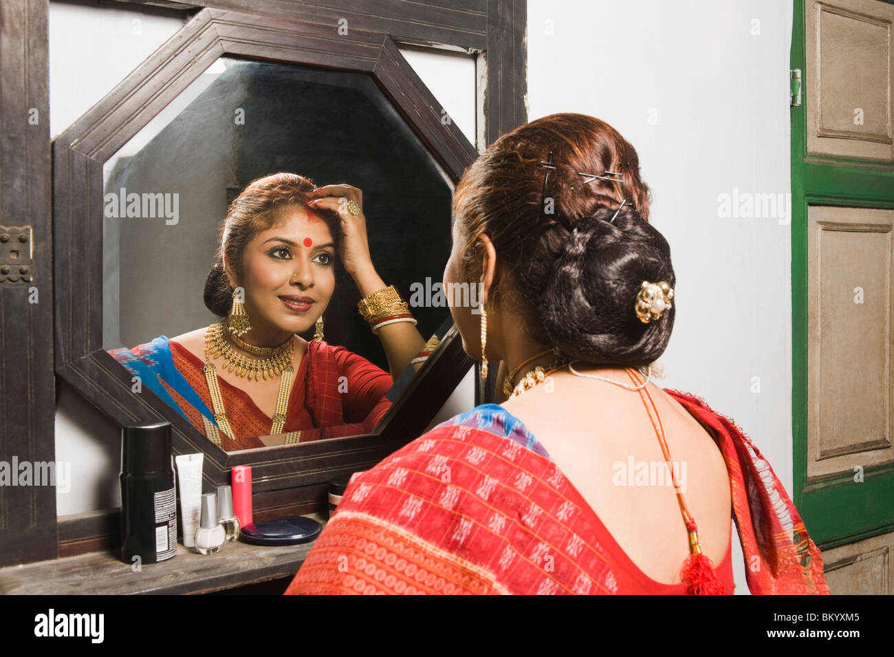 Woman applying sindoor hi-res stock photography and images - Alamy