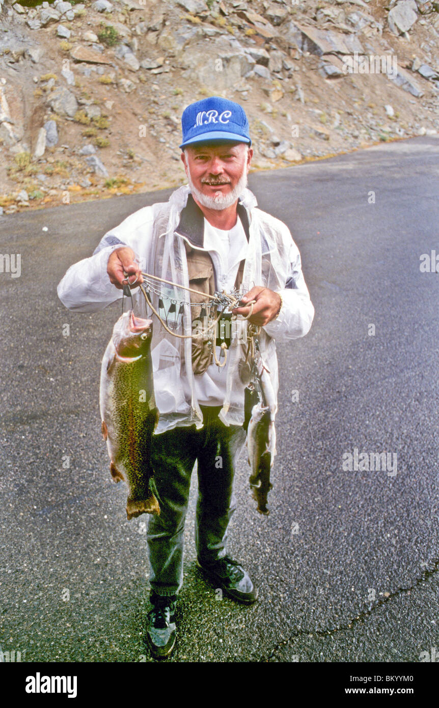 Man fisherman displays seven pound rainbow trout caught in South Lake ...