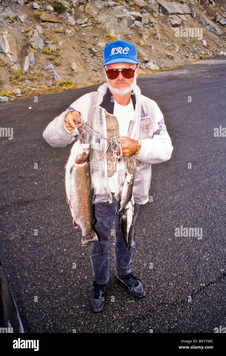 Man fisherman displays seven pound rainbow trout caught in South Lake ...