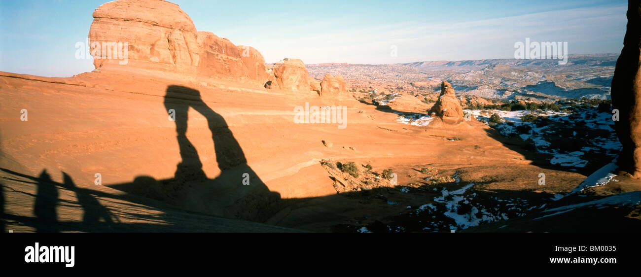Shadow of natural arch on rock formations, Utah, USA Stock Photo - Alamy