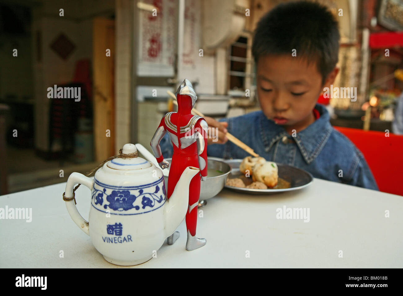 kid, child, young boy Superman toy eating dumpling, biaozi, Little ...