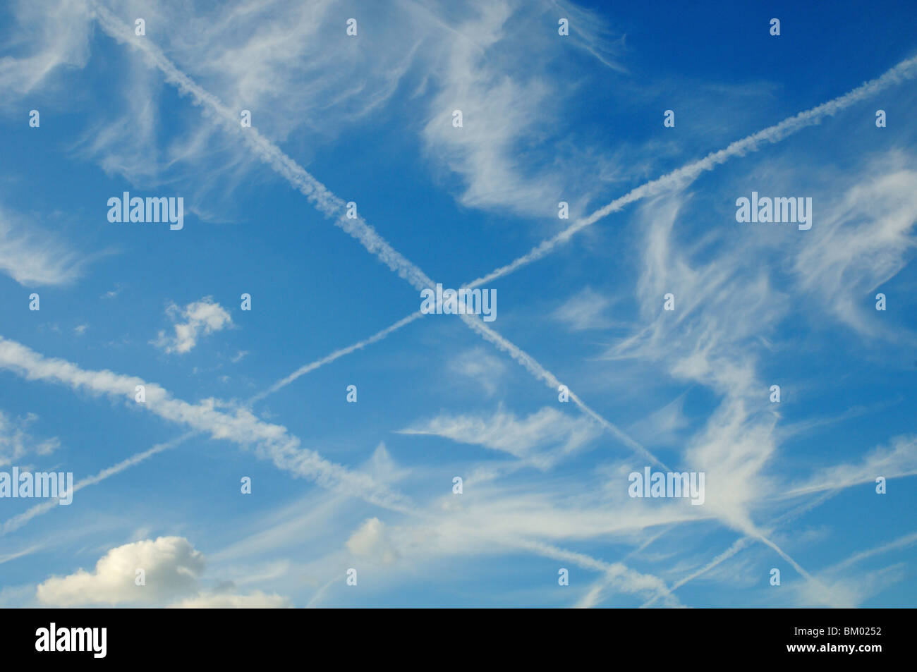 Passenger aircraft with contrails hi-res stock photography and images ...