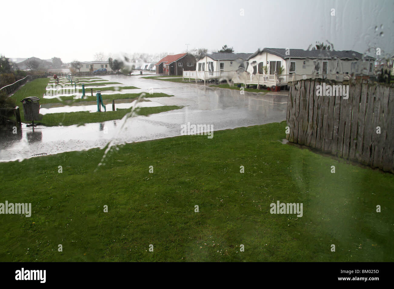 Heavy rain at a holiday campsite for large static caravans Stock Photo ...