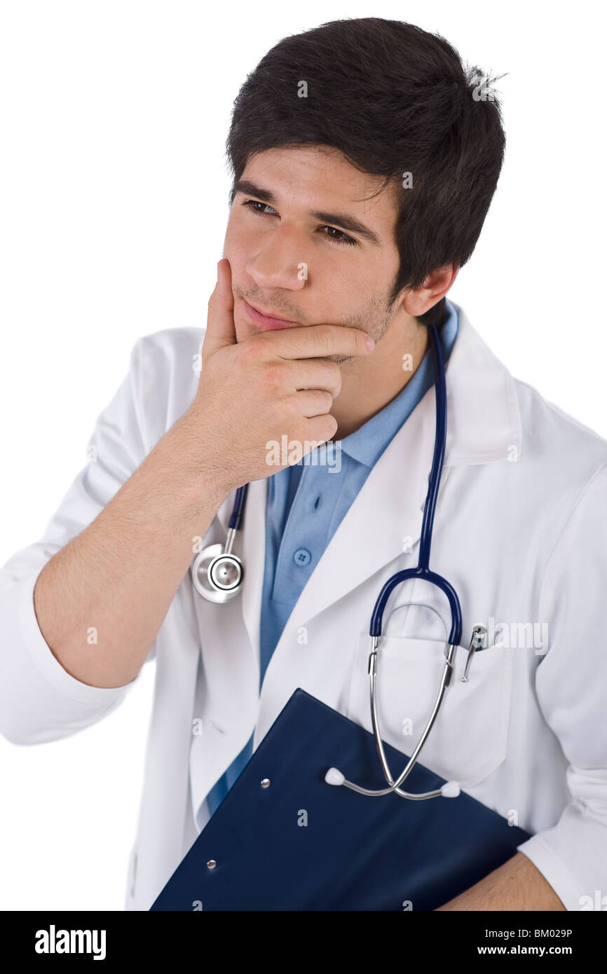 Thoughtful male doctor student with stethoscope on white background ...