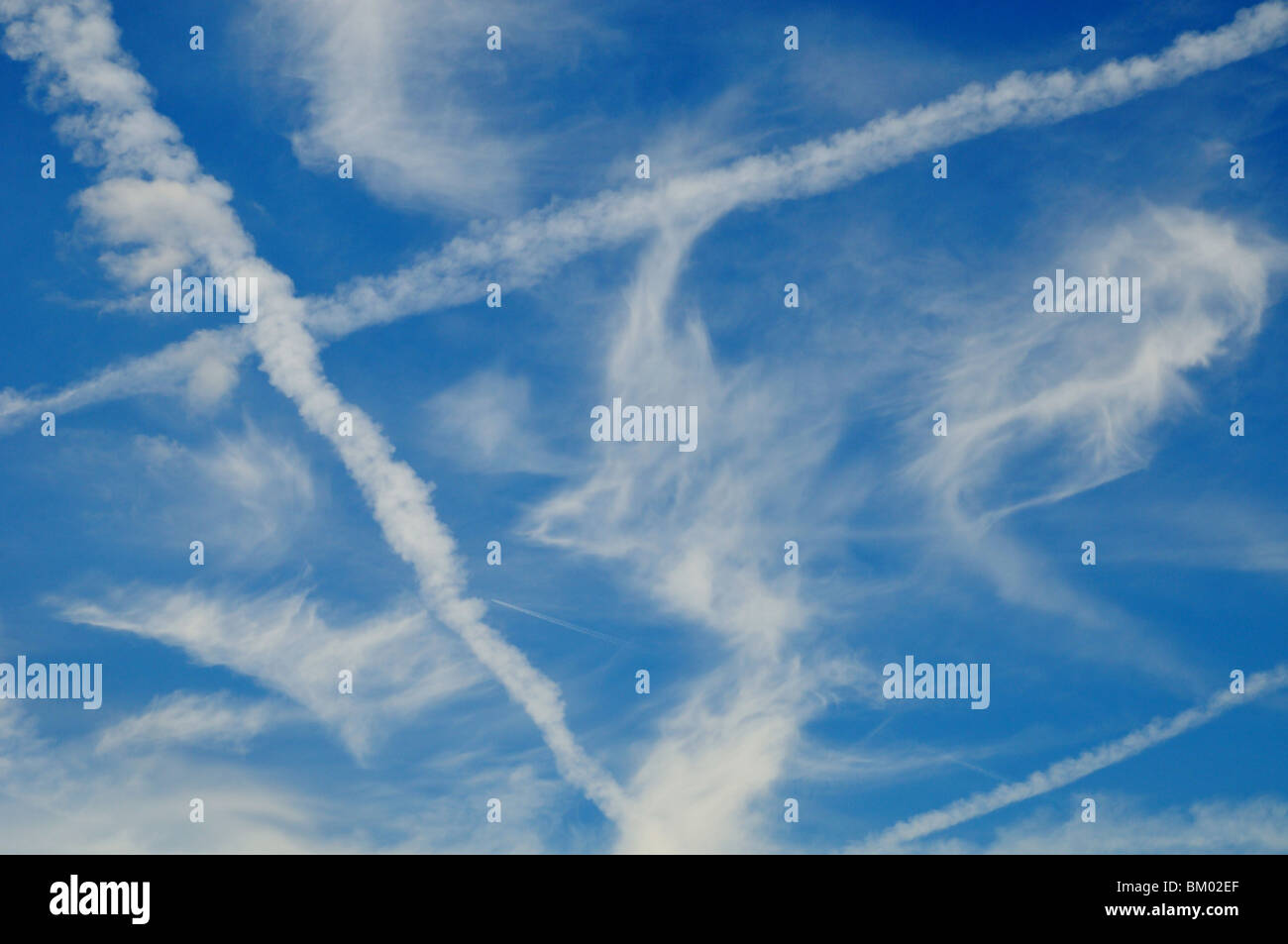 Passenger aircraft with contrails hi-res stock photography and images ...