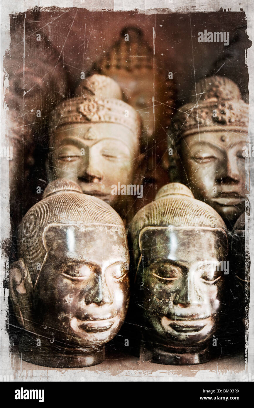 Asian sculptured heads Stock Photo - Alamy