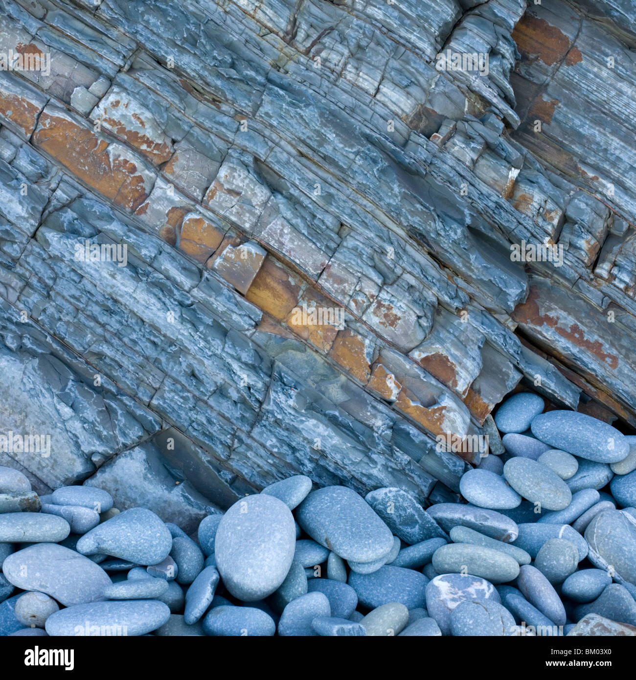 Beach abstract with blue rocks Stock Photo - Alamy