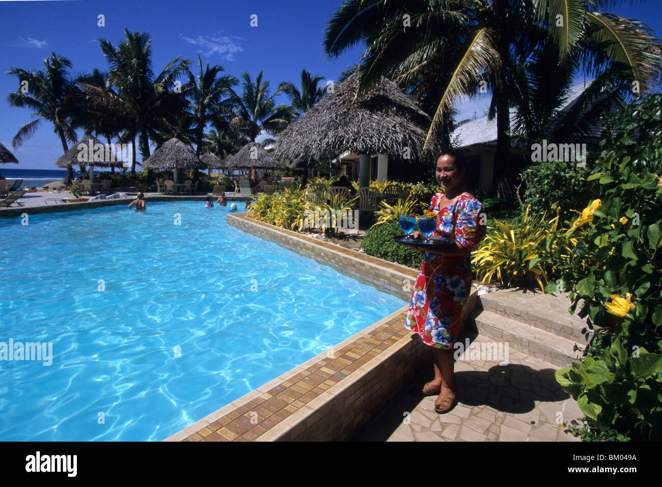 Cocktail waitress swimming pool edgewater hi-res stock photography and ...