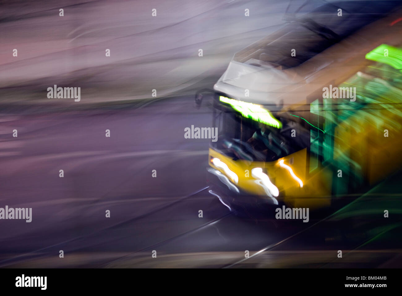 Panning shot of a tram by night, Berlin, Germany Stock Photo - Alamy