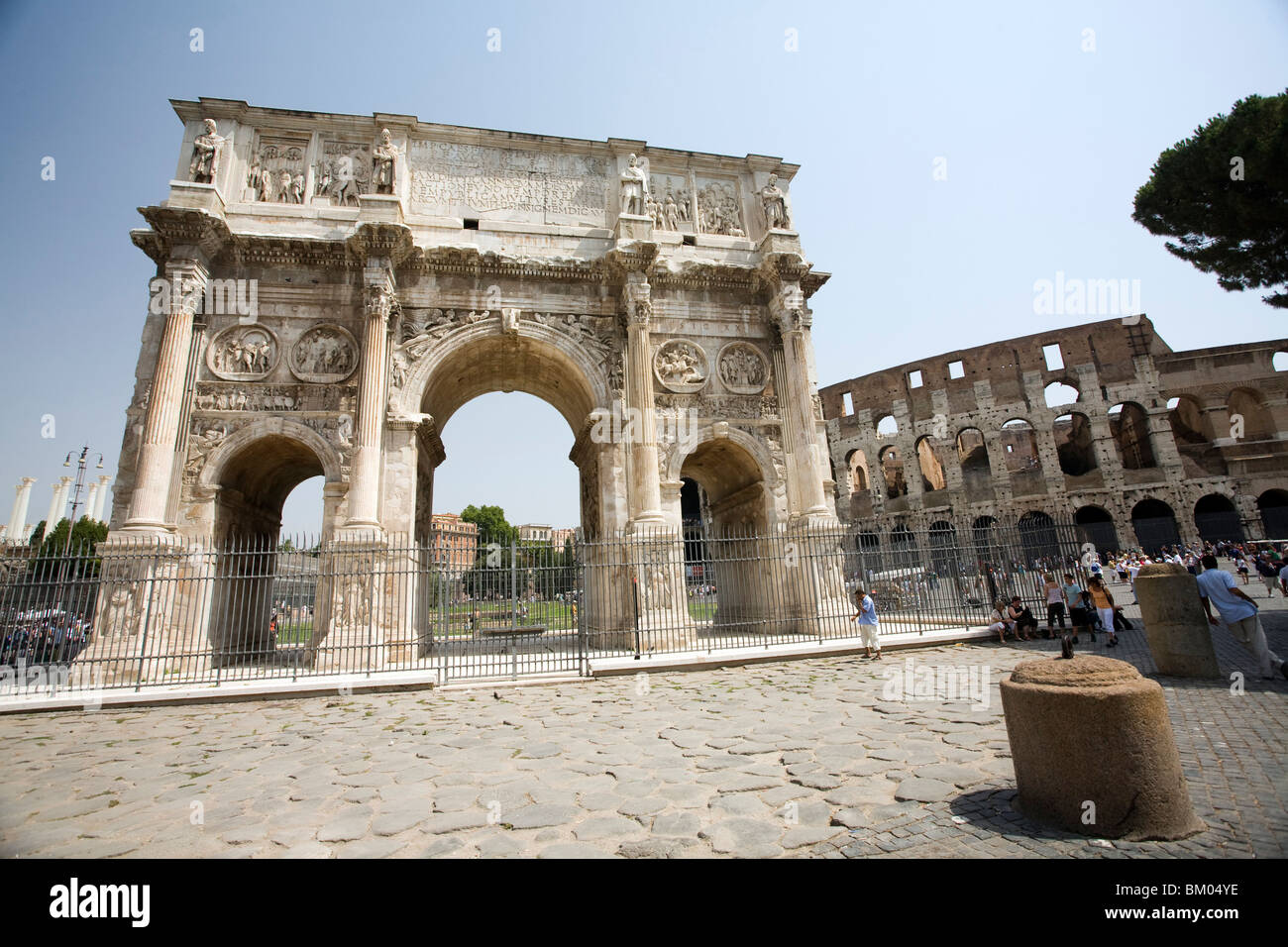 The arch of Constantine with the Colosseum on the background Stock ...