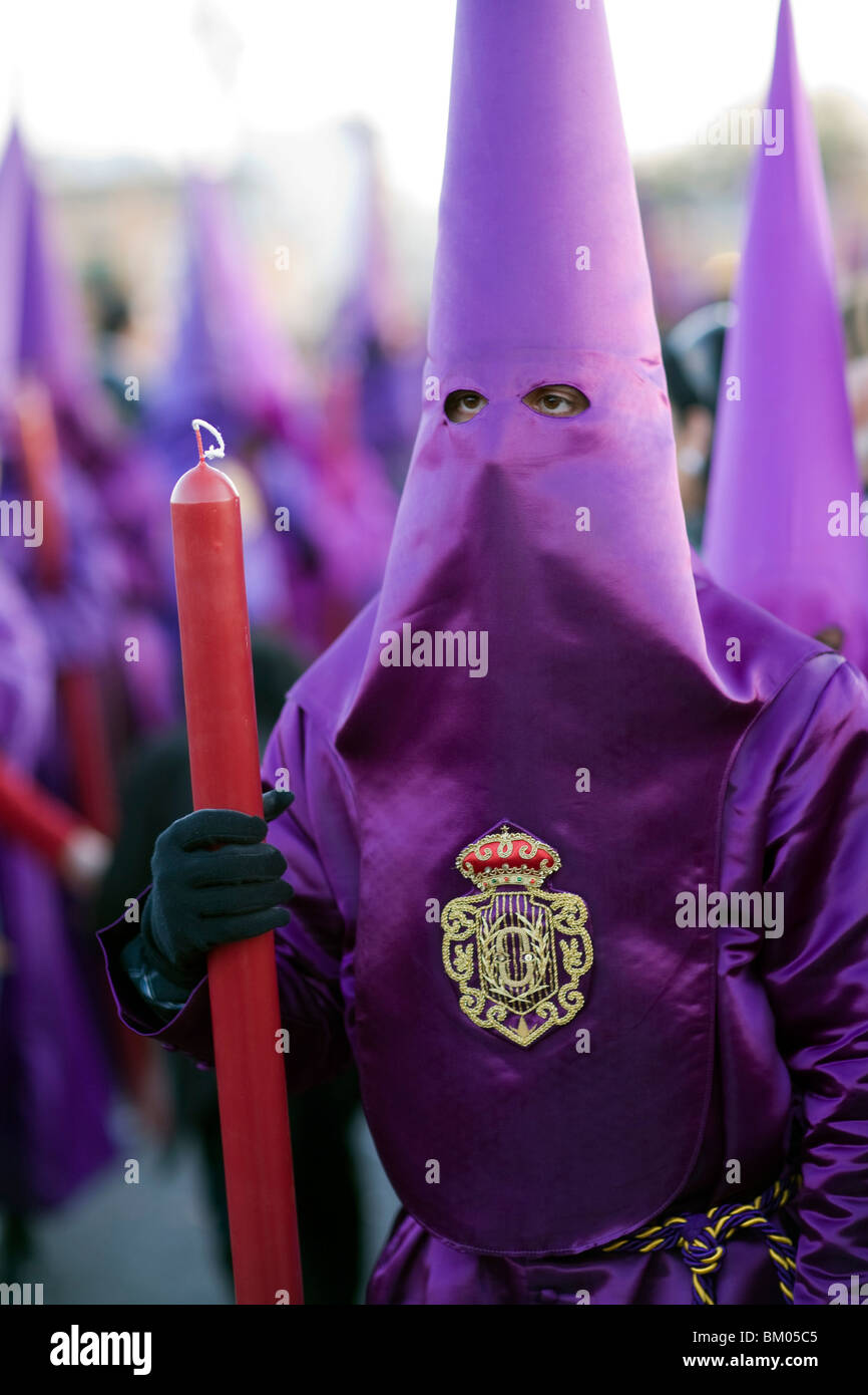 Penitent bearing candle, Good Friday, Seville, Spain Stock Photo - Alamy