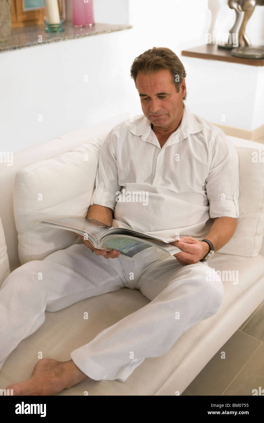 Man reading a journal Stock Photo - Alamy