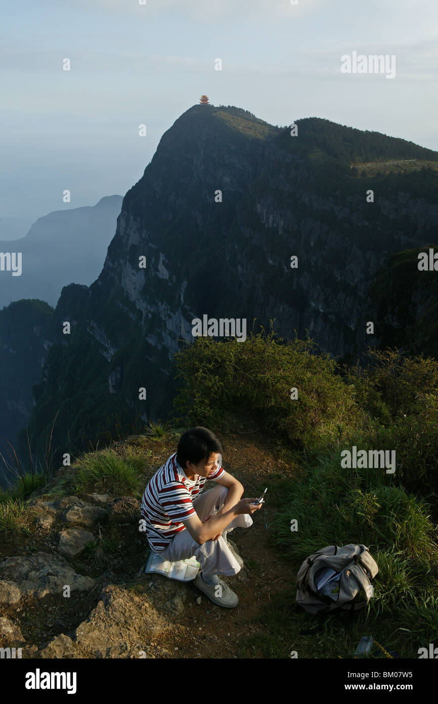 tourist with mobile phone, viewing Wan Fo Ding pagoda, tourist with ...