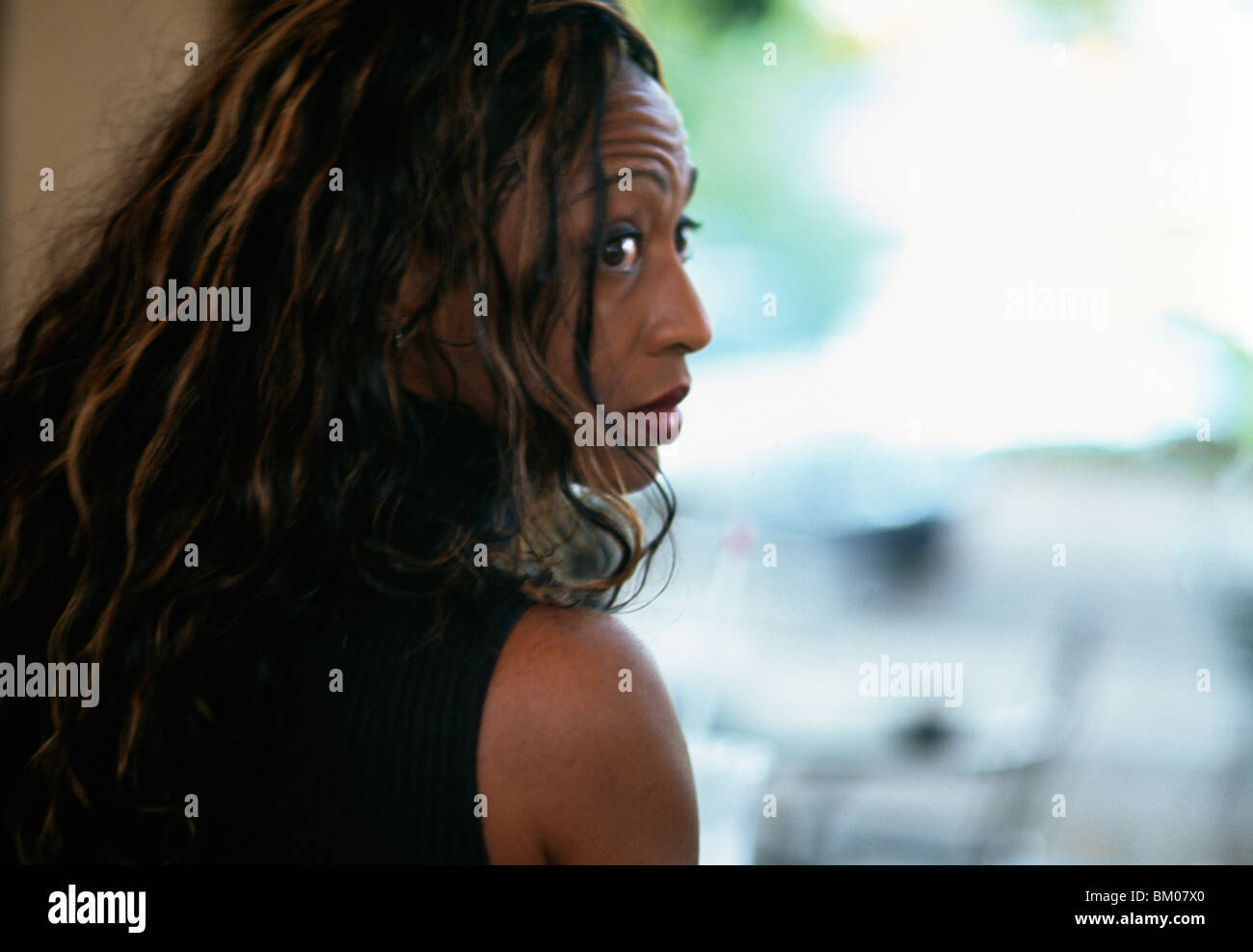 African-American mid adult woman raising eyebrows Stock Photo - Alamy