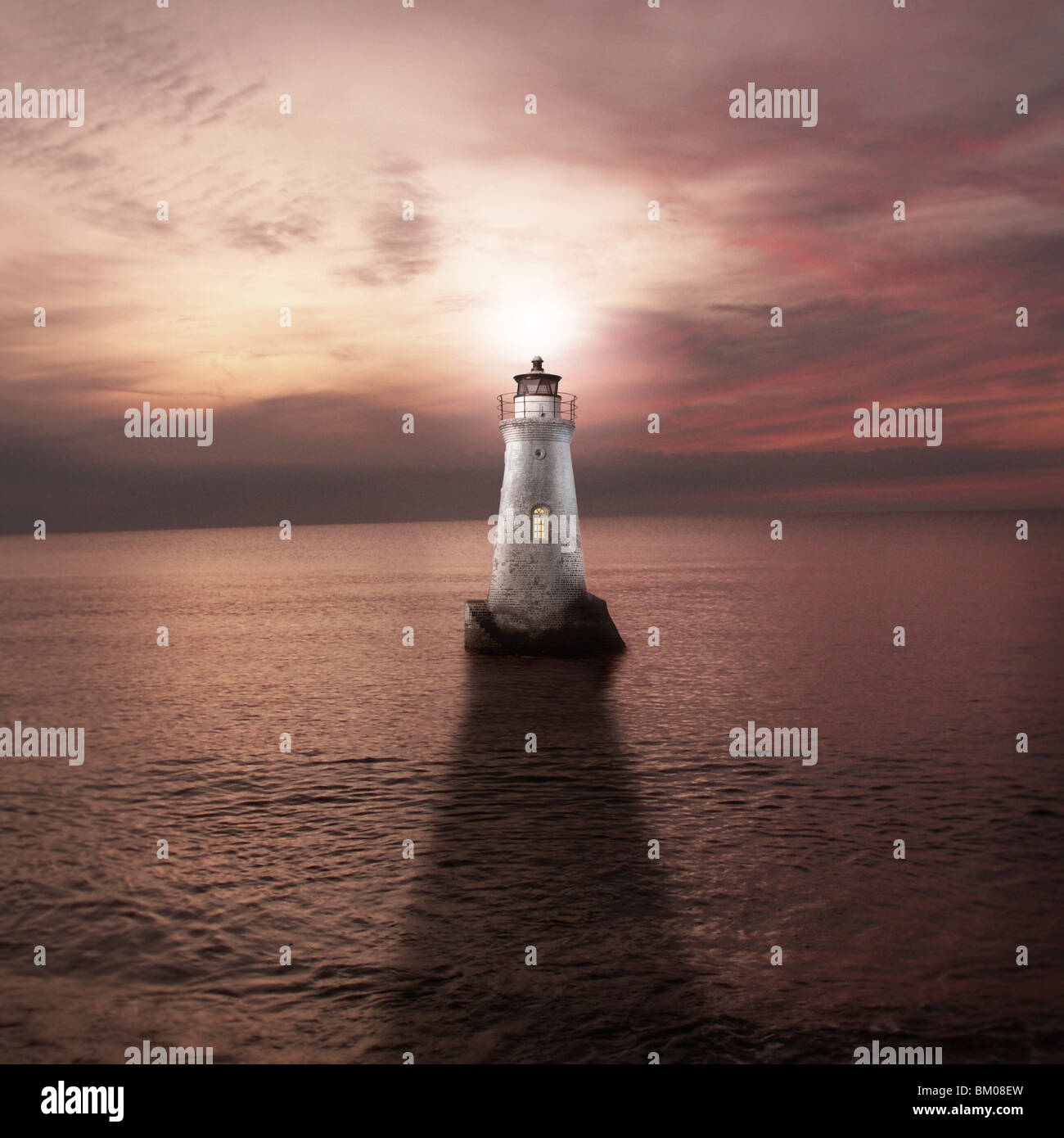 A white lighthouse with sunset and calm sea Stock Photo - Alamy
