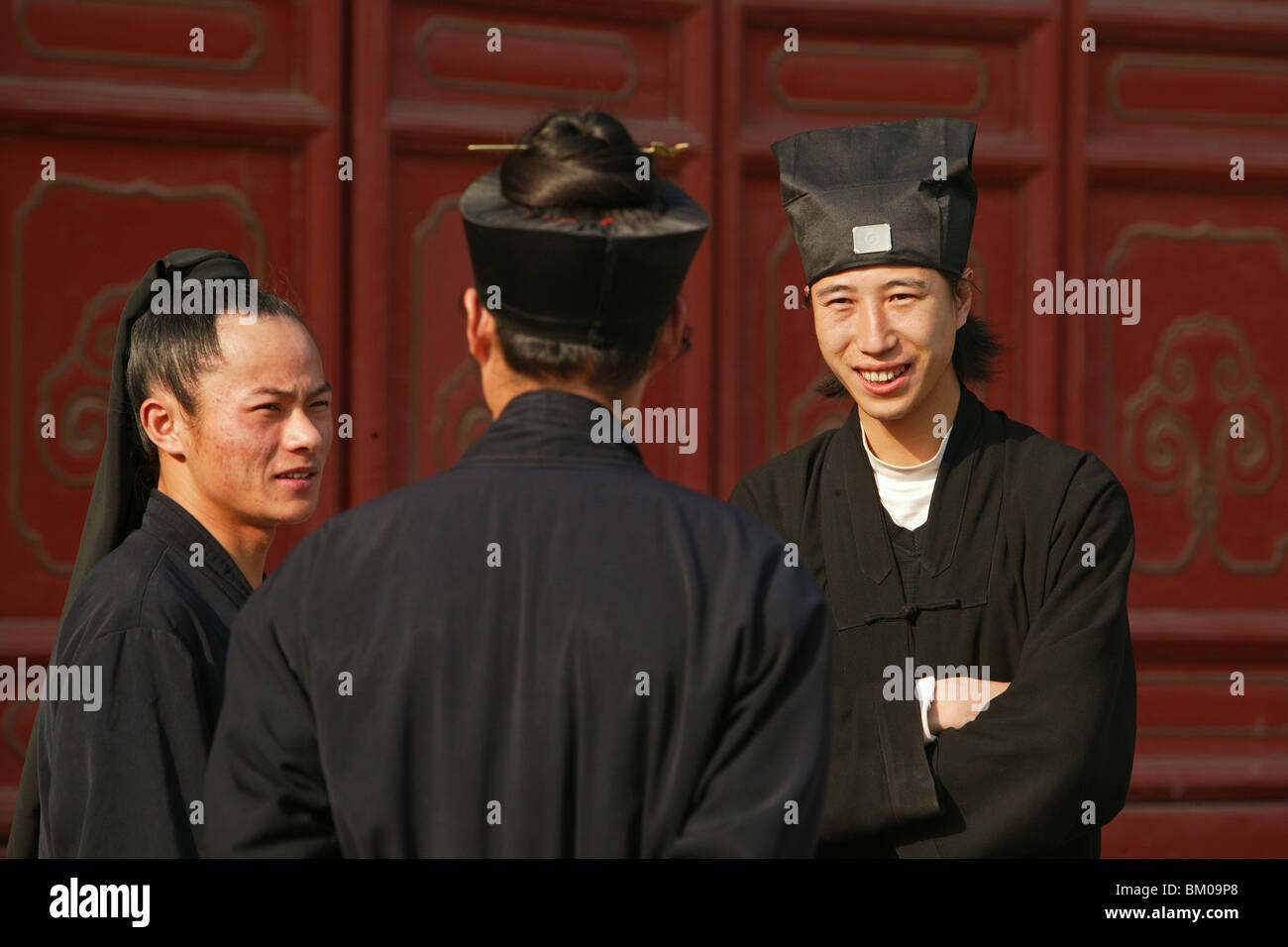 Taoist monks with various hair style and hats, Zhongyue temple Taoist ...