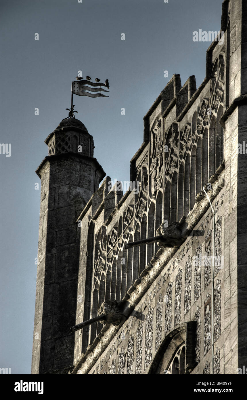 Four birds sitting on a turret of a church in Eye Suffolk England Stock ...