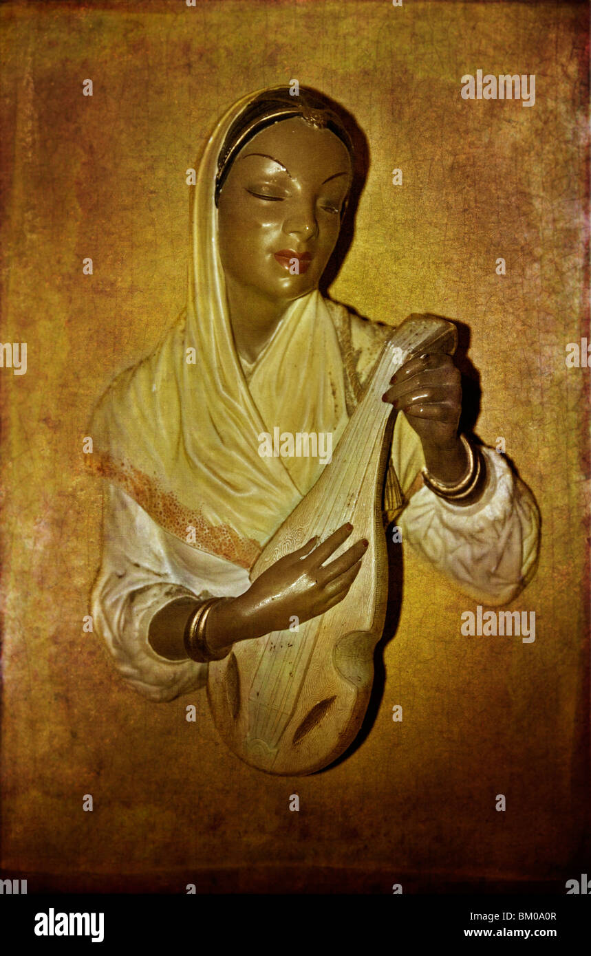 1950's bosson character of a young asian woman playing the mandolin ...