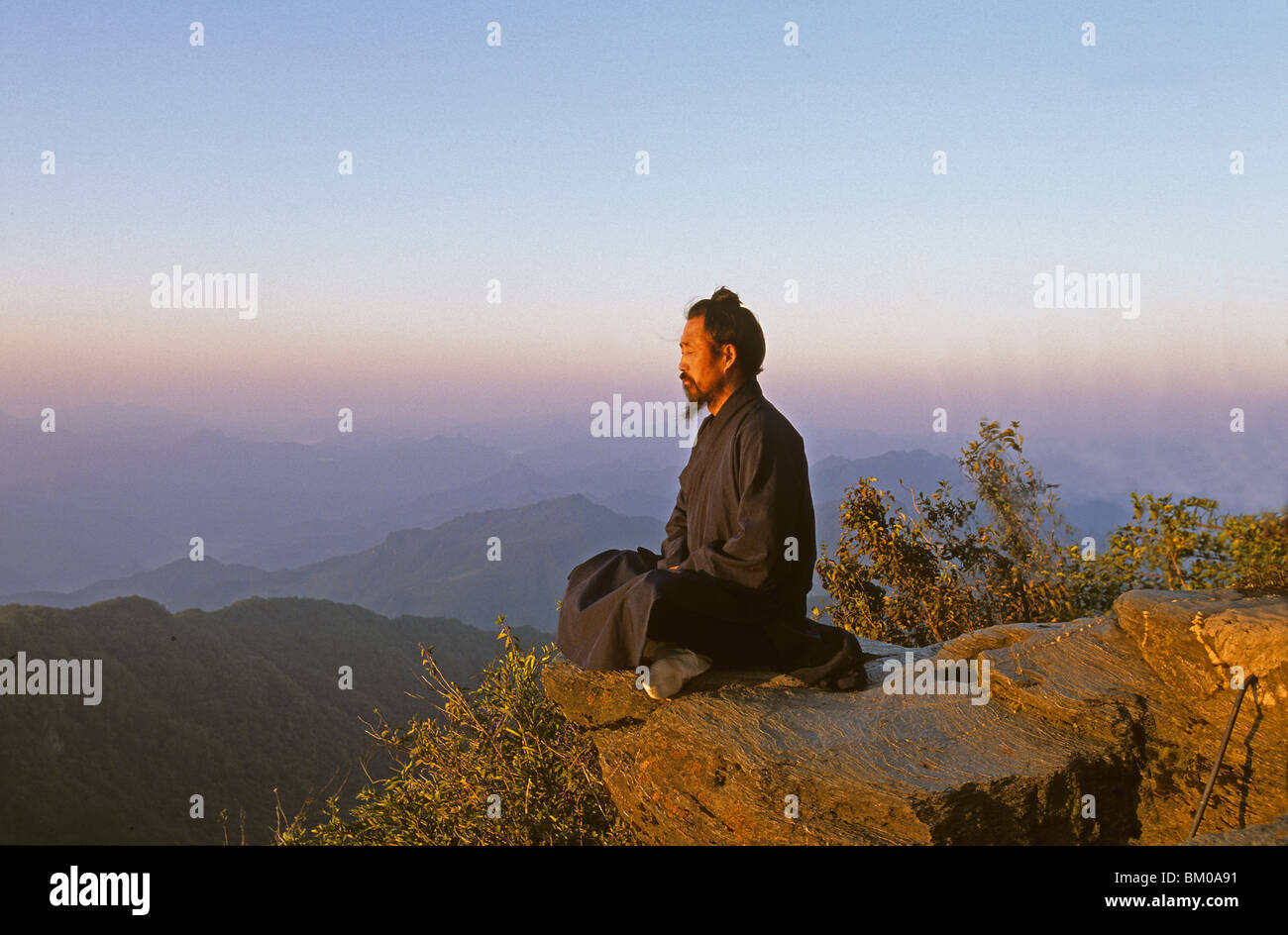monk meditating in lotus position, sunrise, Golden Hall, Jindian Gong ...