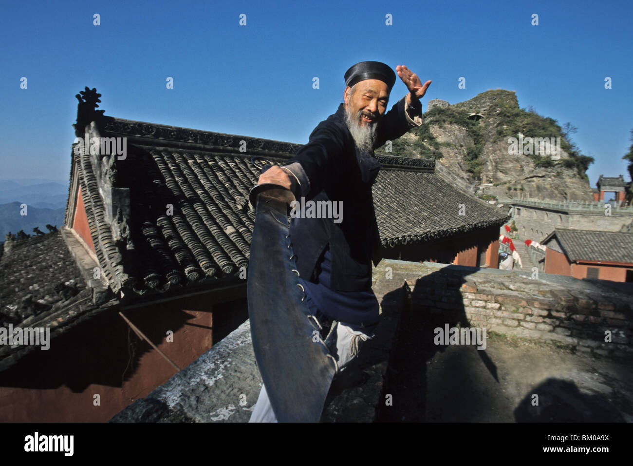 Taichi master, monk demonstrates a ritual sword fight, Tianzhu feng ...