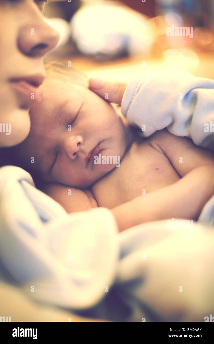 Woman cradling baby blanket hi-res stock photography and images - Alamy