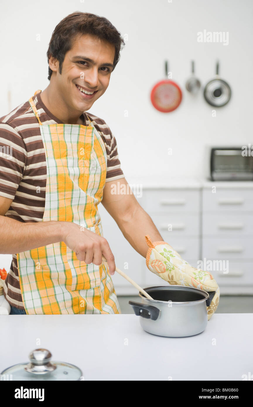Man cooking in the kitchen Stock Photo - Alamy
