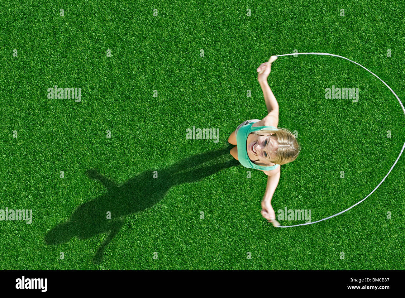 Girl jumping rope Stock Photo - Alamy