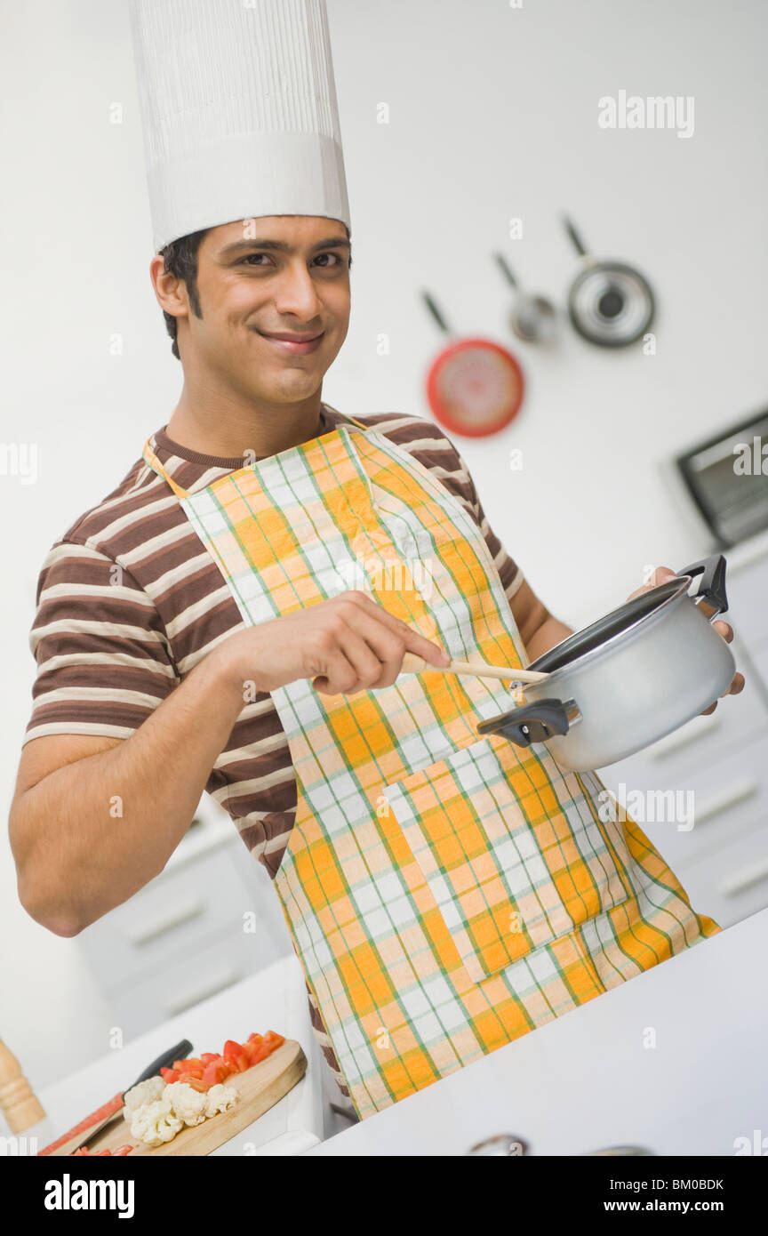 Man cooking in the kitchen Stock Photo - Alamy