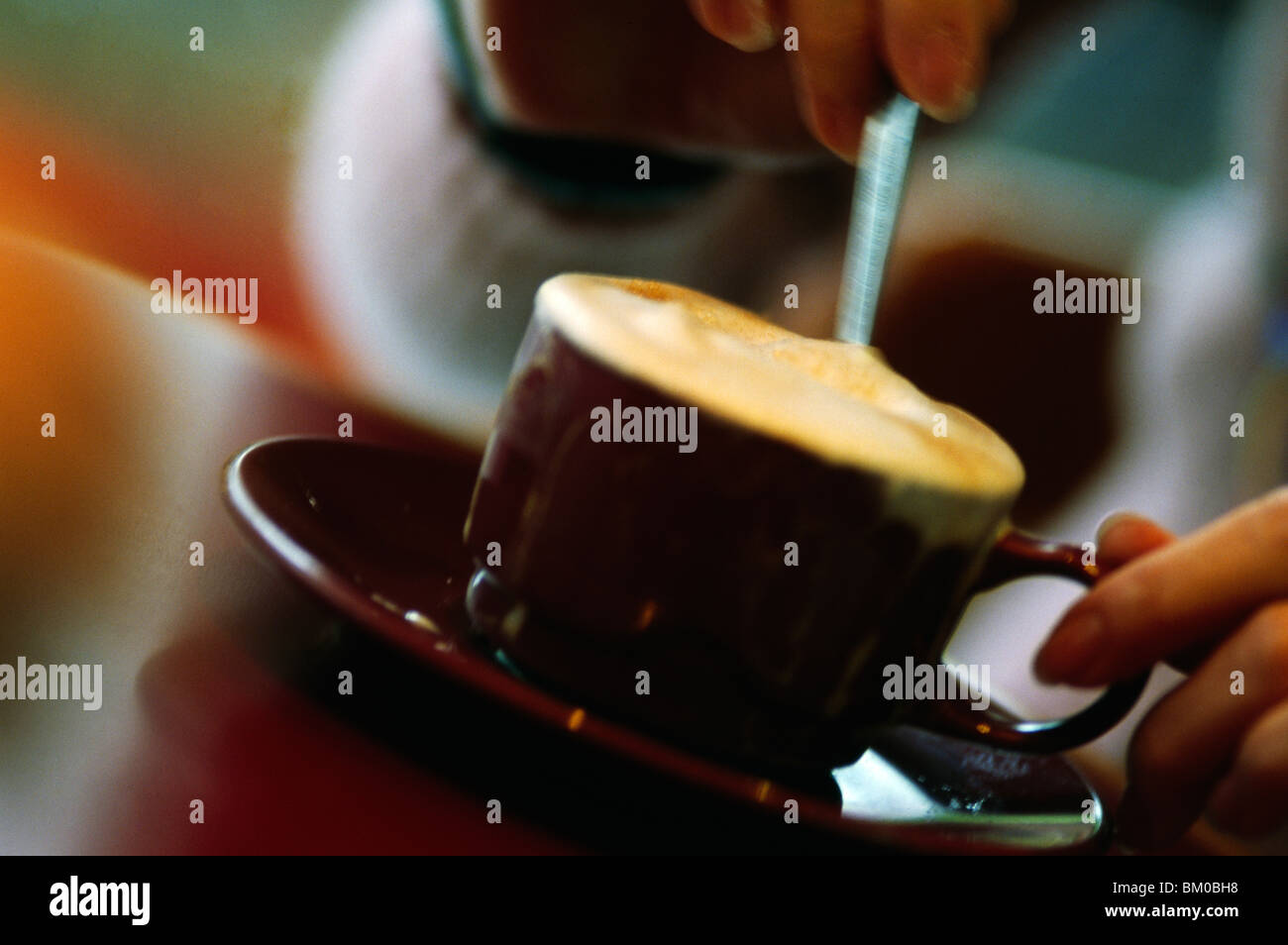 Person stirring coffee, close-up Stock Photo - Alamy