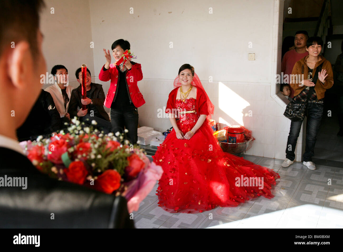 Bridegroom picking up the bride at her parents' house, traditional ...