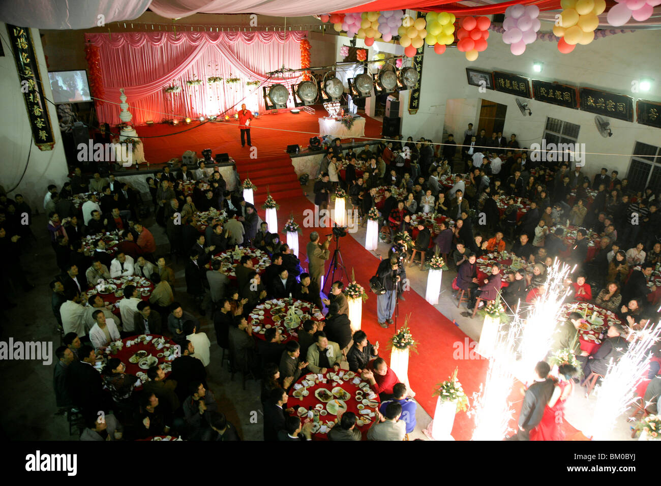 People at a festival room at a traditional chinese wedding, Jinfeng ...