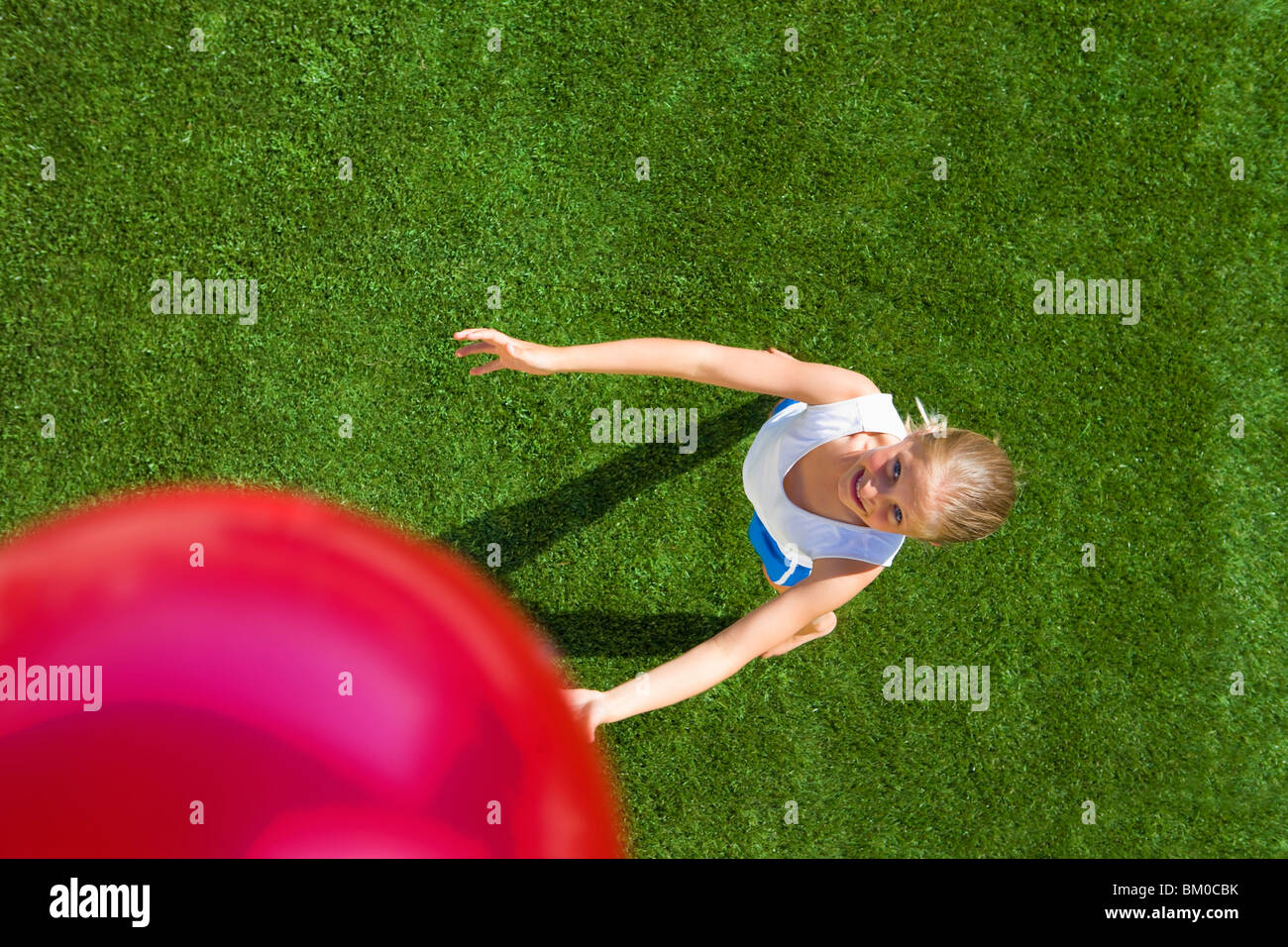 Girl playing ball Stock Photo - Alamy