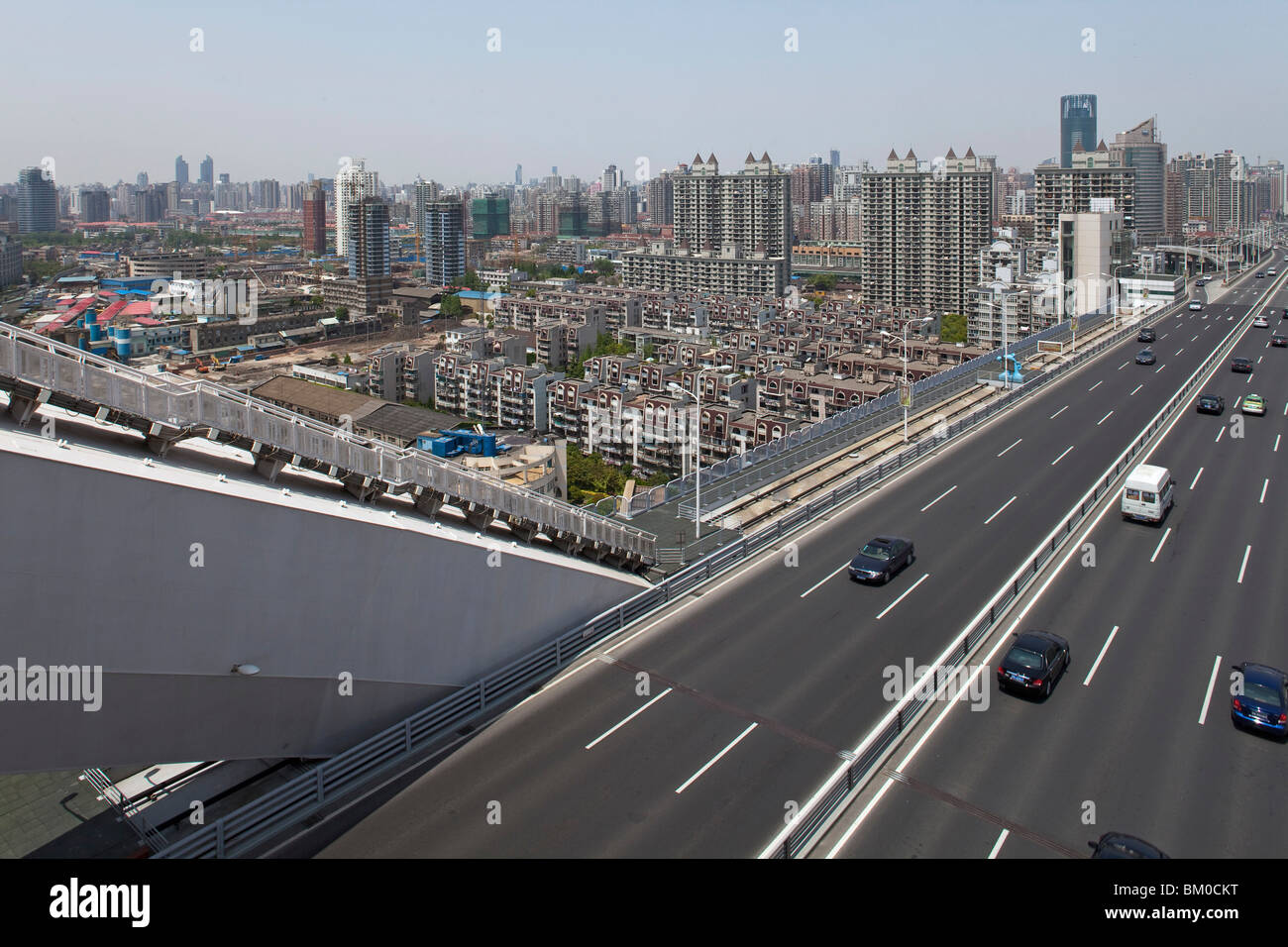 The Lupu bridge in front of the high rise buildings of Shanghai, China ...