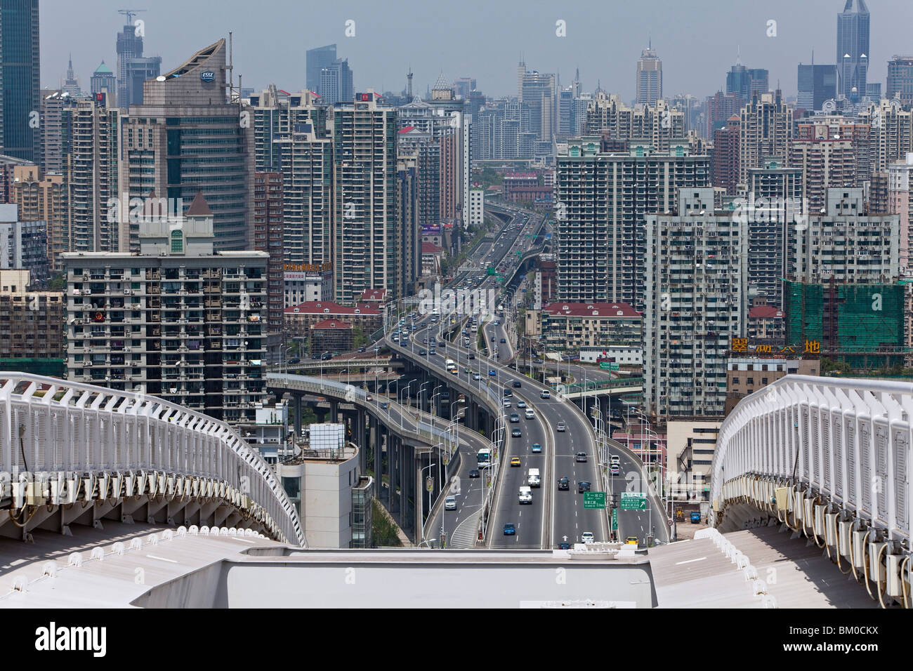 The Lupu bridge in front of the high rise buildings of Shanghai, China ...
