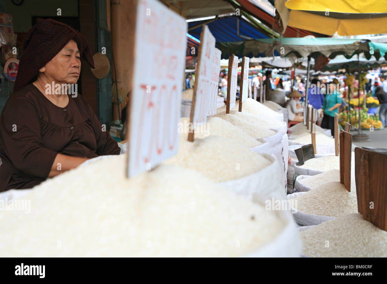 Old woman selling rice on the Ben-Thanh market, Saigon, Ho Chi Minh ...
