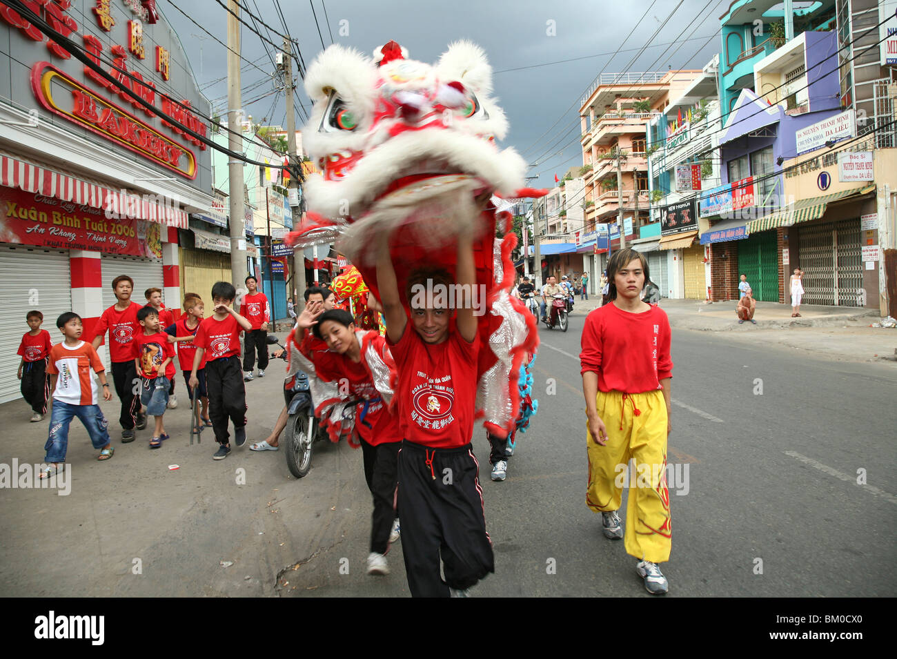 Teenagers at dragon dance during Tet festival at a suburb, Saigon, Ho ...