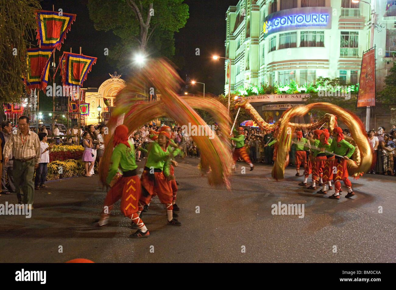 People at dragon dance during Tet festival at night, Saigon, Ho Chi ...