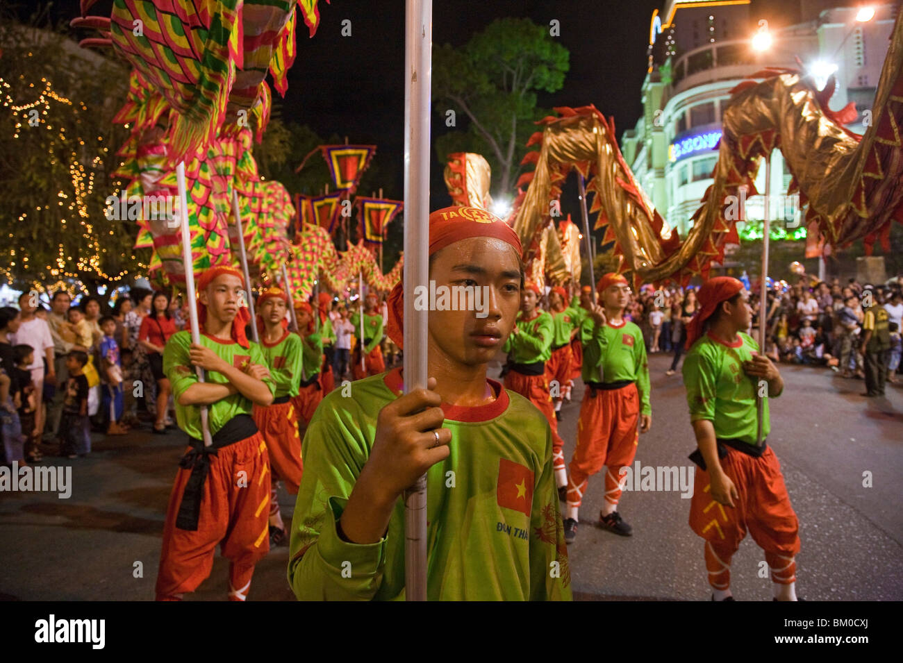 People at dragon dance during Tet festival at night, Saigon, Ho Chi ...