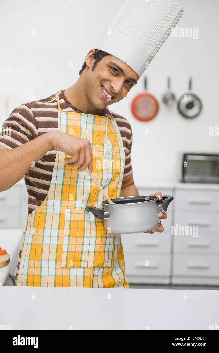 Man cooking in the kitchen Stock Photo - Alamy