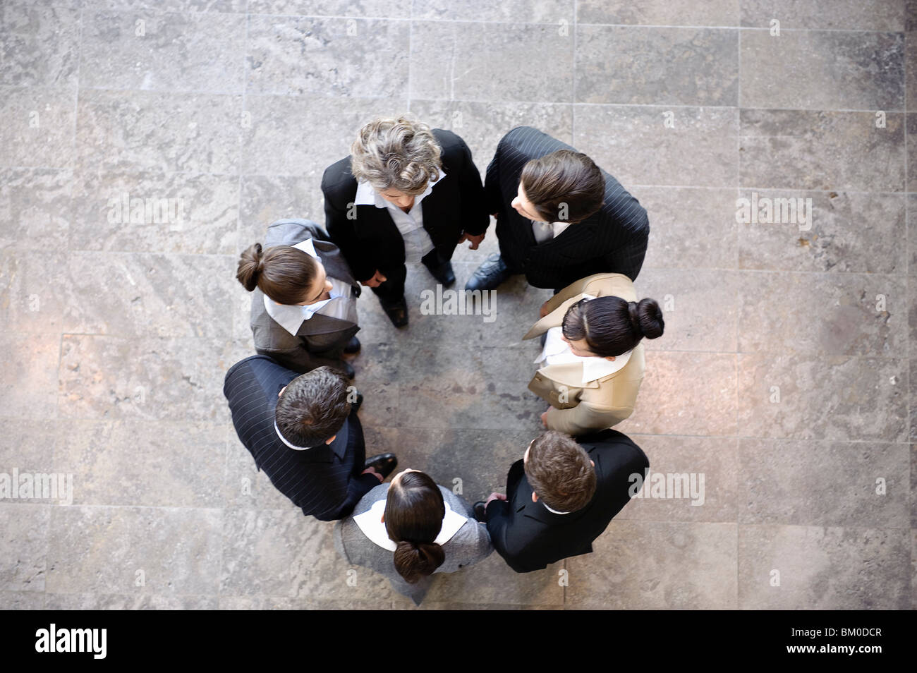 Forming people above shape hi-res stock photography and images - Alamy