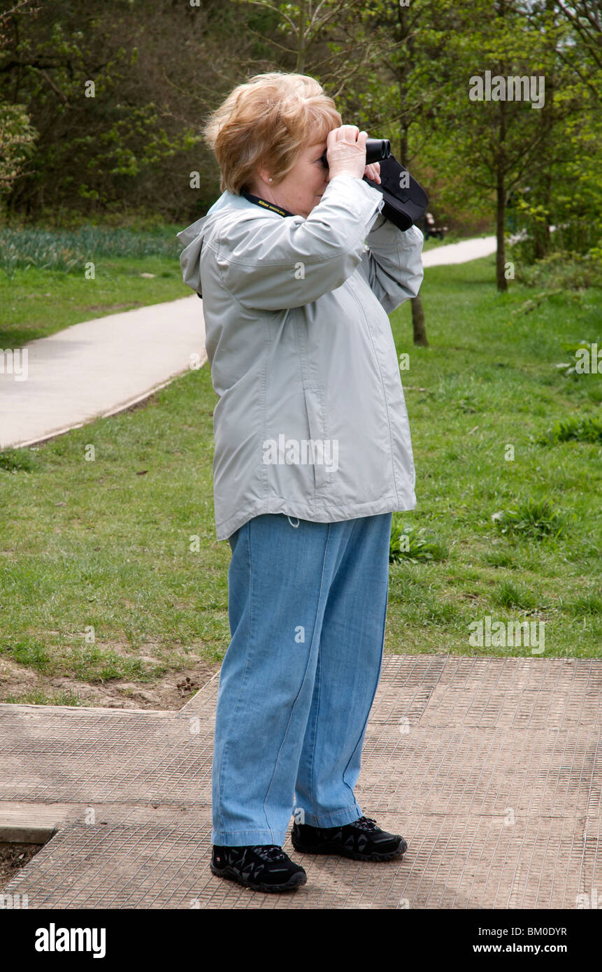 woman using binoculars Stock Photo - Alamy