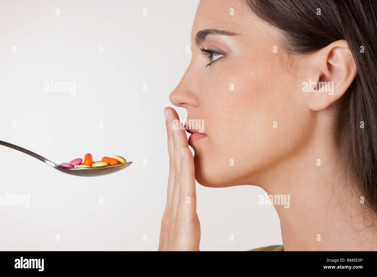 Woman hand blocking spoonful pills hi-res stock photography and images ...