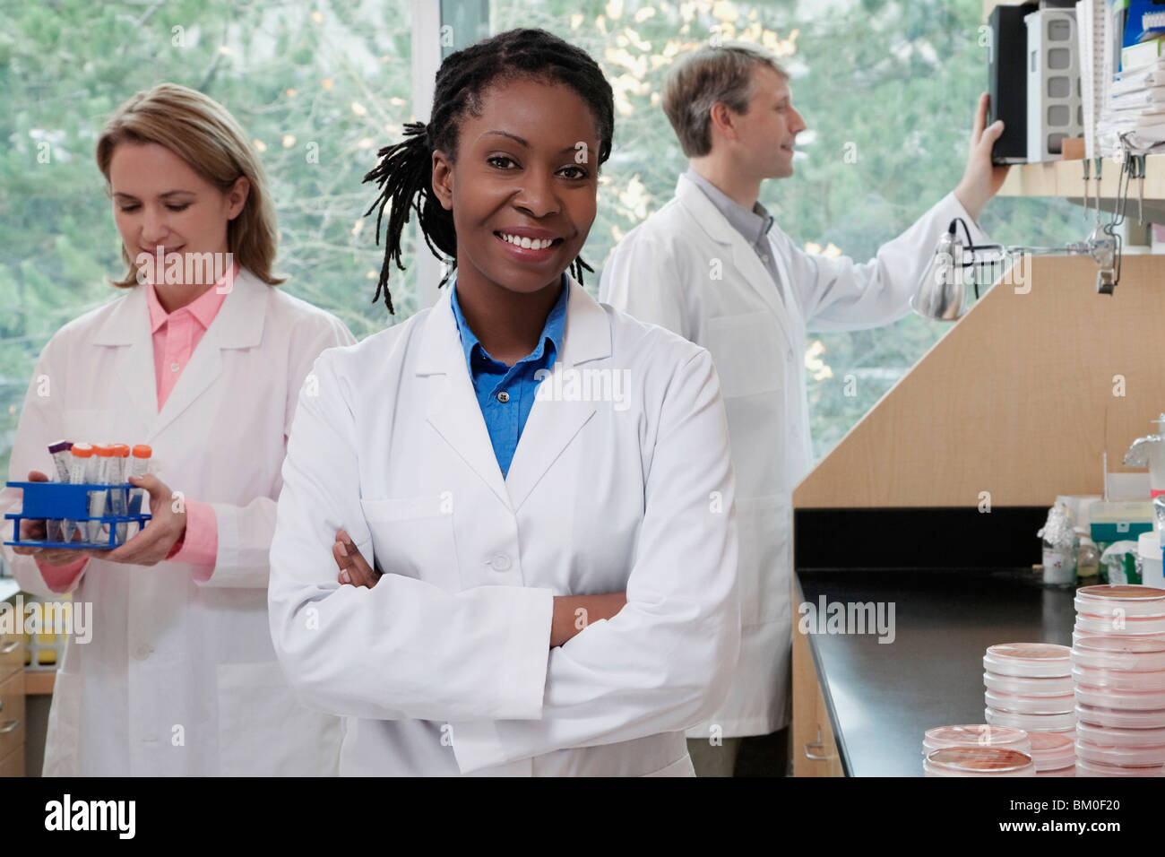 Three doctors working in a laboratory Stock Photo - Alamy