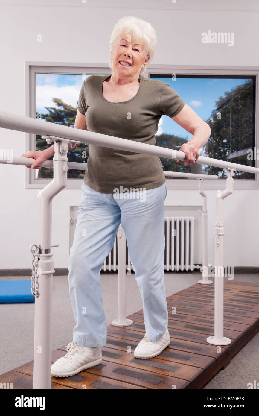 Disabled woman practicing on a walker Stock Photo - Alamy