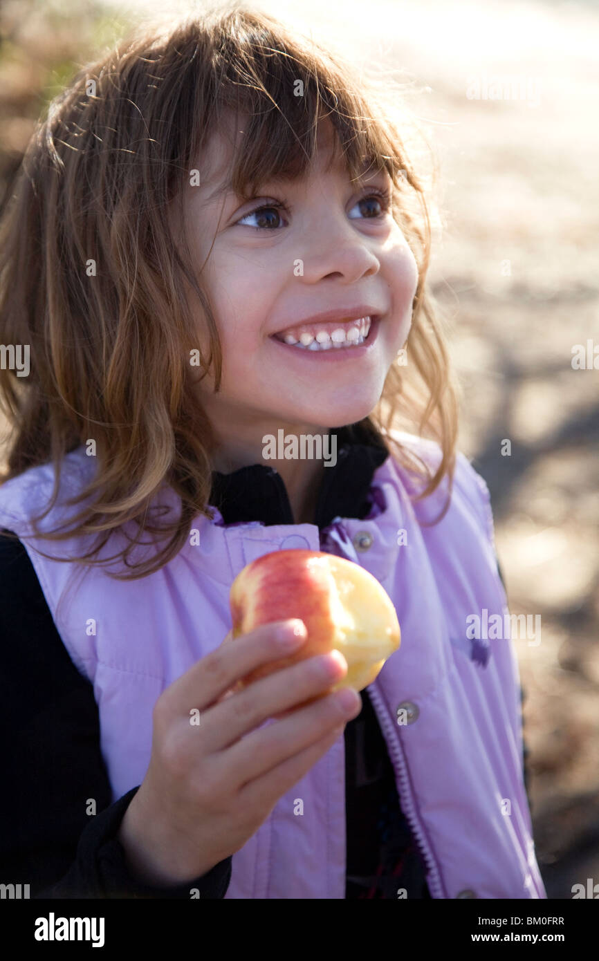 Young girl eating apple, Ontario Stock Photo - Alamy